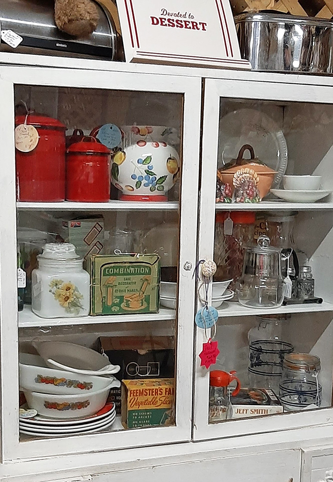 Grandma's kitchen cabinet comes to life with vintage canisters and cookware that survived decades of family dinners and holiday gatherings.