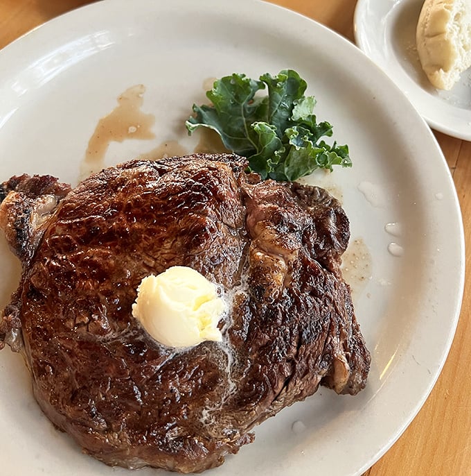 A perfectly seared ribeye with a pat of melting butter&mdash;proof that sometimes the simplest pleasures are the most profound.