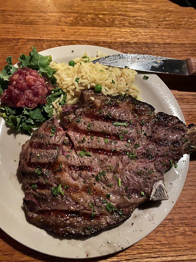 This isn't just a ribeye; it's a masterpiece of meat with perfect grill marks that would make Picasso jealous. The rice isn't the star, but it knows its supporting role.