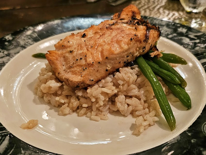 This salmon doesn't just flake&mdash;it practically serenades your fork. Perched atop risotto like a culinary crown jewel.