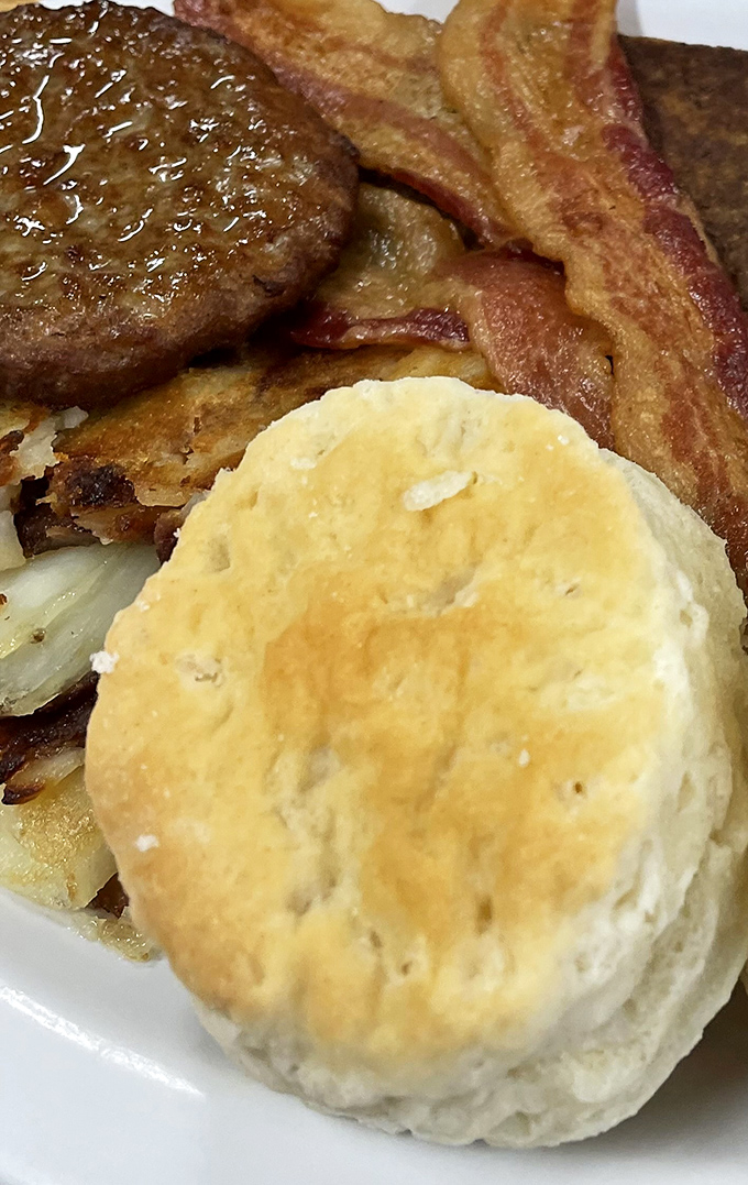 That golden sausage biscuit and crispy bacon represent everything wonderful about Southern breakfast comfort food.