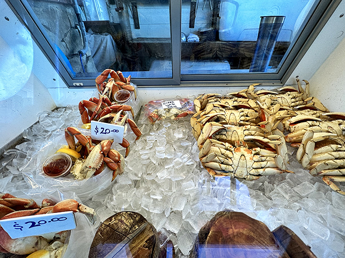 Dungeness crab displayed on ice like jewels in a treasure chest. This isn't just seafood&mdash;it's the Pacific Ocean's finest gift.