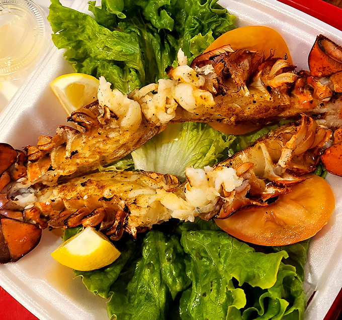 Split lobster tail that would make Neptune himself jealous, served on a bed of lettuce with lemon wedges that aren't just for show.