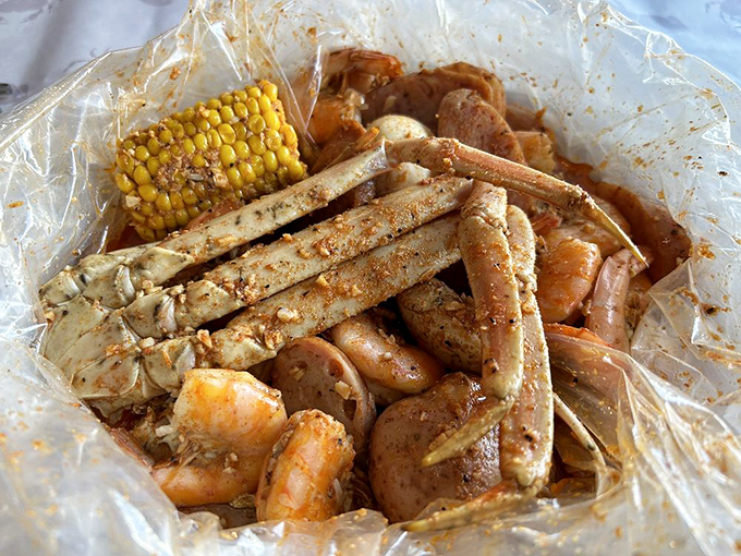 Seafood alchemy at its finest&mdash;crab legs, shrimp, and corn bathing together in spiced butter. Plastic bag fine dining is real.