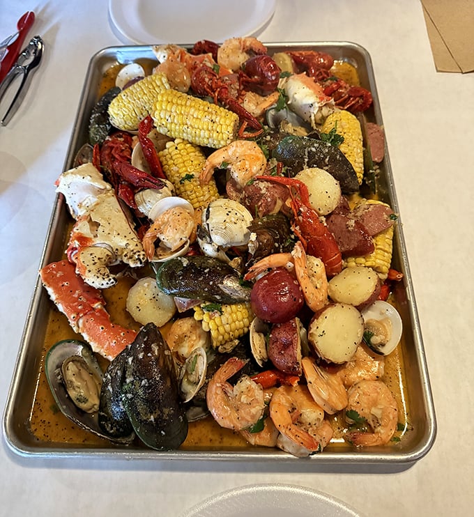 Seafood boil nirvana! This glorious metal tray holds the equivalent of an underwater family reunion, where everyone actually gets along.