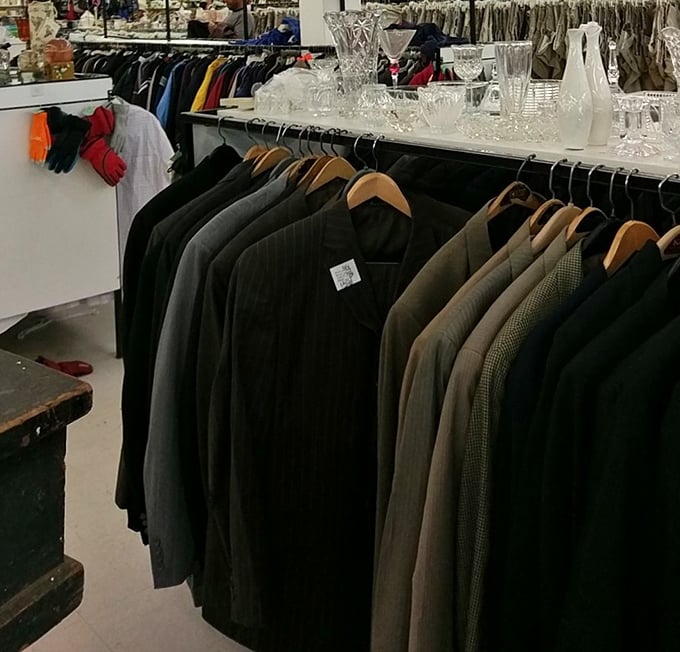 Men's suits hang with dignified patience, waiting for their second act. That charcoal blazer could be your next job interview MVP.