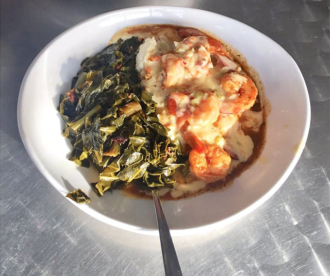 Shrimp and grits nirvana has been achieved! Those plump shrimp nestled on creamy grits alongside collard greens is the comfort food embrace we all need.