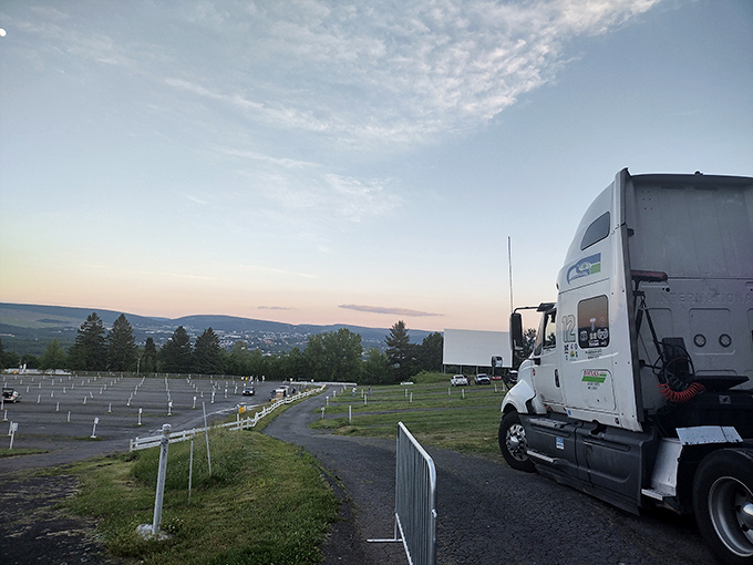 The drive-in's sprawling layout offers a perfect vantage point for both the feature presentation and the rolling Pennsylvania hills beyond.