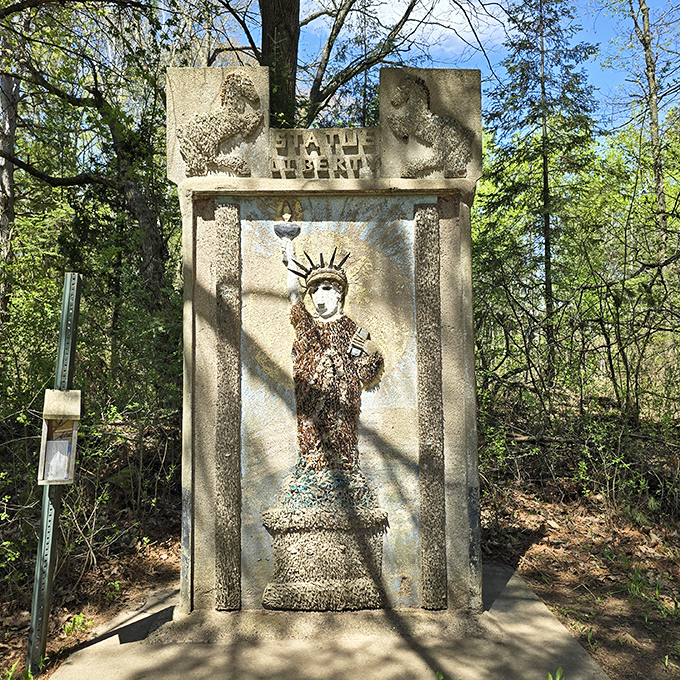 Lady Liberty gets the Midwest treatment—less "give me your tired masses" and more "check out my bottle cap crown and concrete robe."