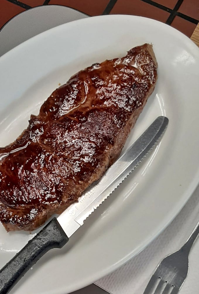 This steak isn't just cooked&mdash;it's been transformed into a glistening masterpiece that would make even vegetarians question their life choices.