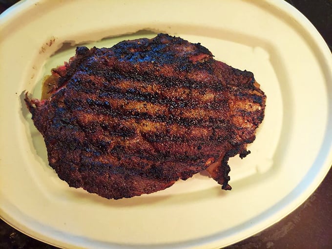 Behold the star of the show! This pepper-crusted masterpiece has the kind of char that makes carnivores weak at the knees.