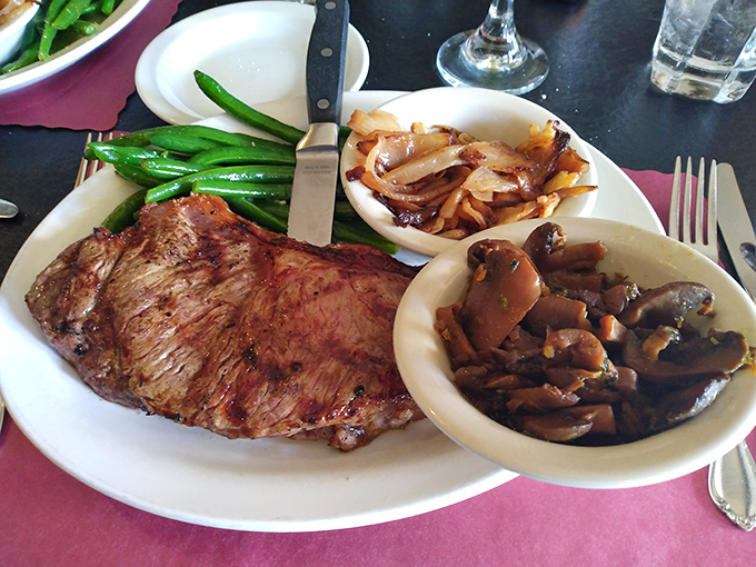 Carnivore's delight: A perfectly seared steak flanked by vibrant green beans and mushrooms sautéed to earthy perfection. Simple food done right never needs explanation.
