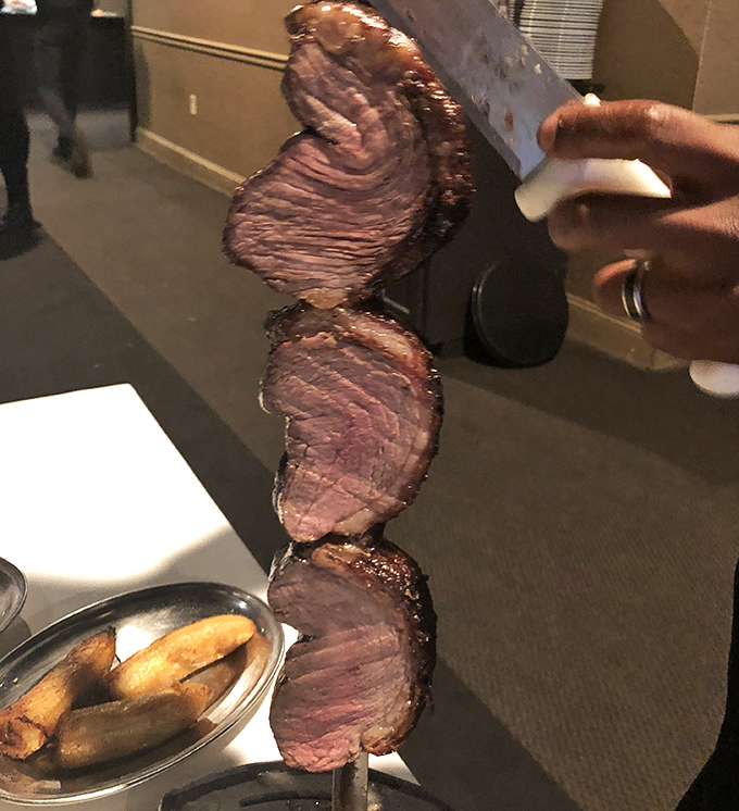 Behold the holy trinity of beef on a skewer! Each slice reveals the perfect gradient from charred exterior to rosy center.