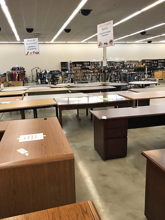 Office desks await their next career move, standing at attention like hopeful job applicants ready to support your next great novel or tax return.