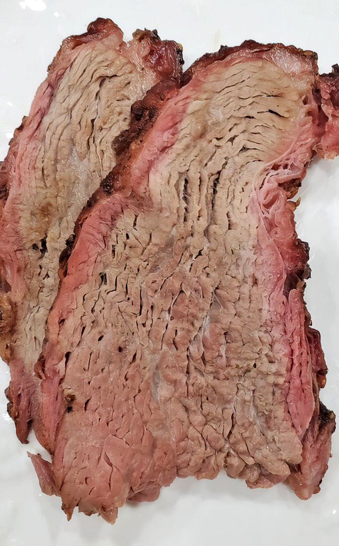 This tri-tip's perfect pink center and textured grain tells you everything&mdash;someone in that kitchen understands the sacred art of smoking beef.