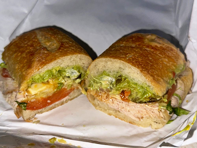 Behold the architectural marvel of layers, where bread meets filling in perfect harmony. One bite and everyday sandwiches are forever ruined.