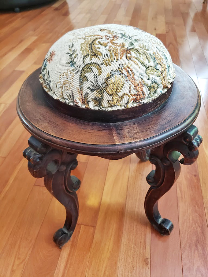 Victorian craftsmanship meets needlepoint artistry in this footstool. Imagine the stories it could tell about proper posture in parlors past.