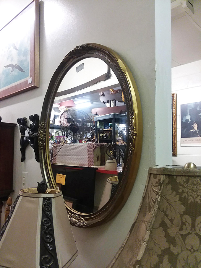 Mirrors like this don't just reflect your face—they reflect decades of style. This ornate oval beauty has probably seen hairstyles it's still trying to forget.