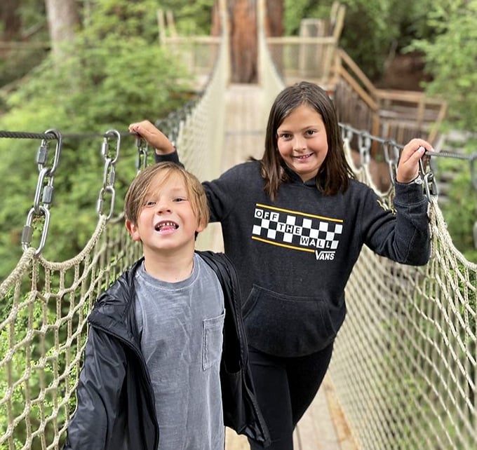 The suspension bridge transforms ordinary humans into explorers, creating those magical childhood moments that somehow feel even better when you're all grown up.