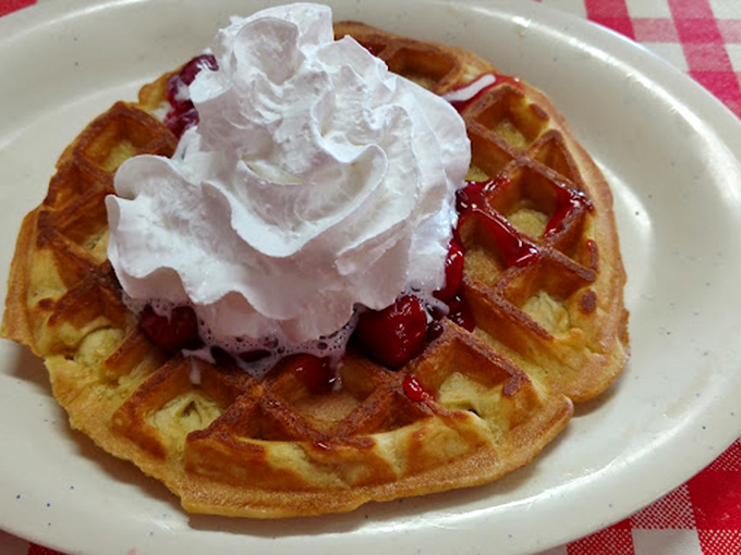 Behold the waffle that launched a thousand road trips &ndash; golden perfection topped with whipped cream dreams.