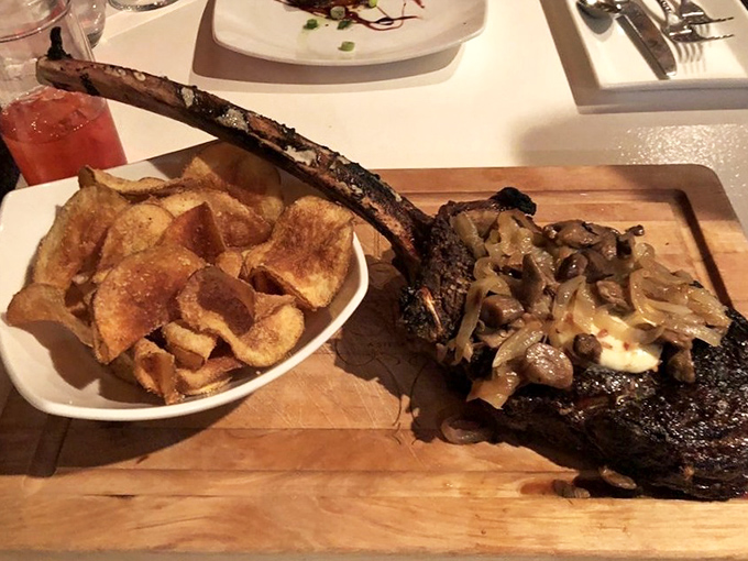 This isn't just steak&mdash;it's a meaty monument with house-made potato chips. That bone could double as a caveman's club in a Flintstones episode.