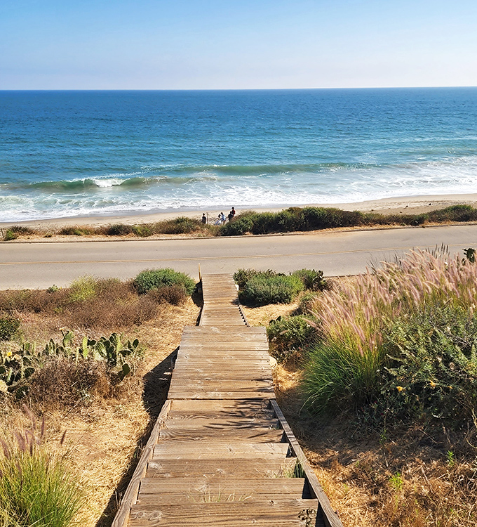 The stairway to heaven is actually made of weathered wood and leads straight to the Pacific. This beach access path invites visitors down to where land meets sea.