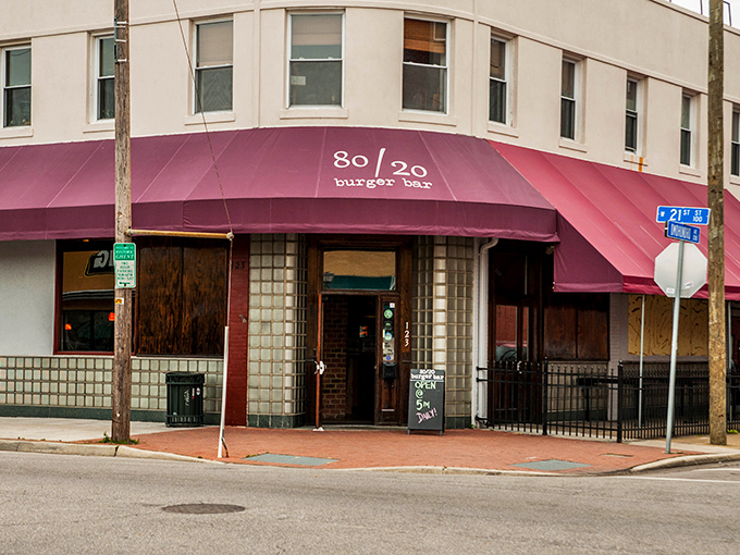 80/20 Burger Bar's corner spot with purple awning stands ready for burger pilgrims. The perfect meat-to-fat ratio isn't just their name&mdash;it's their religion.
