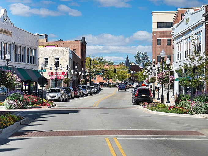 Colorful flowers frame Aurora's charming downtown, where brick buildings and blue skies create postcard-perfect views.