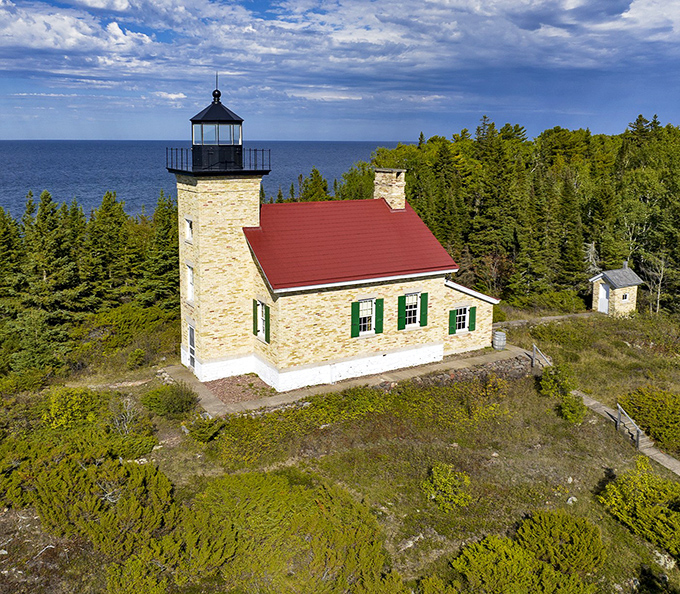 Copper Harbor Lighthouse stands sentinel over Lake Superior like a faithful old friend.