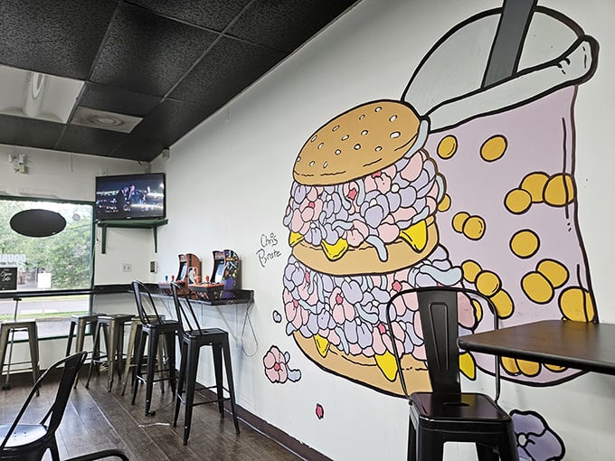 That burger mural isn't just decoration&mdash;it's a promise. Double Up's cozy interior focuses on what matters: seriously good food.