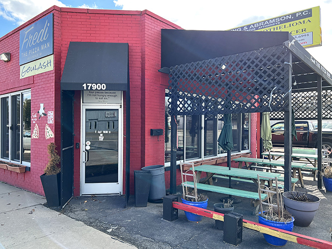 Fredi's vibrant red building stands out like a pizza oasis. That covered patio practically begs you to sit and savor every bite.