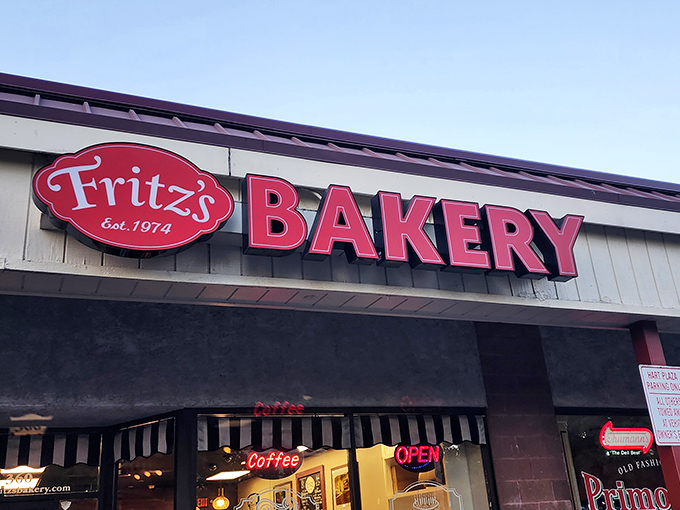 Fritz's bold red sign against the sky is like a bat signal for donut lovers. Established in 1974 and still making mornings better.