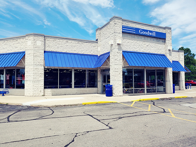 Goodwill's signature blue awnings welcome treasure hunters of all stripes. A department store of possibilities where every purchase tells a story.