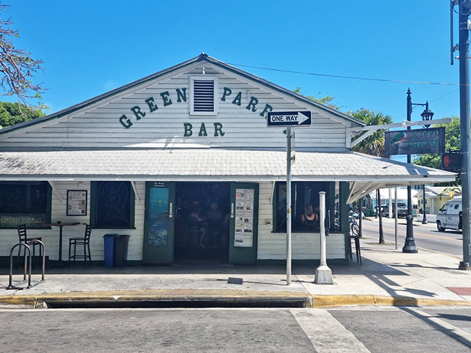 The Green Parrot's weathered facade stands as a defiant middle finger to pretentious beach bars everywhere.