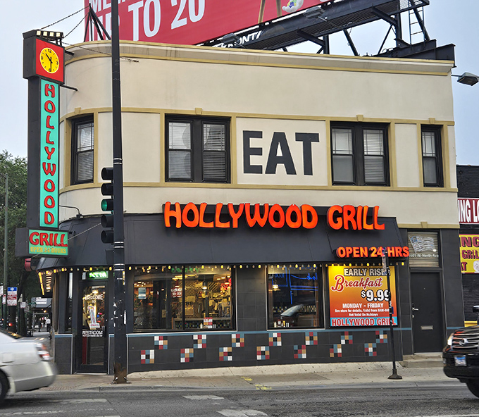 Hollywood Grill's commanding "EAT" sign leaves no room for confusion about its purpose. A 24-hour beacon for the breakfast-obsessed.