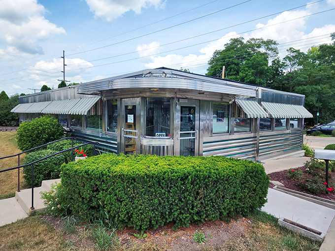 Joni's gleaming silver exterior shines like a beacon of hope for the breakfast-deprived. This classic diner car promises timeless comfort.