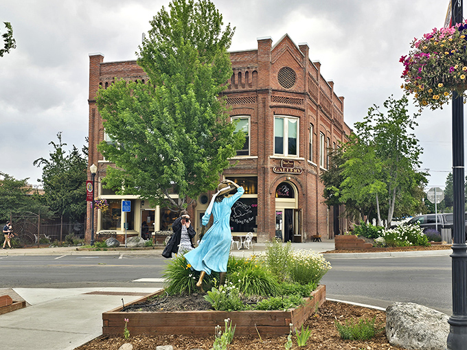 A graceful statue, blooming flowers, and timeless brick charm—Joseph’s downtown beautifully blends art, history, and small-town warmth in one perfect scene.