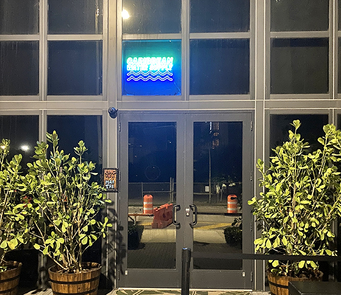 Kaona's sleek, modern entrance with its glowing blue sign feels like discovering the password to Miami's best-kept culinary secret.