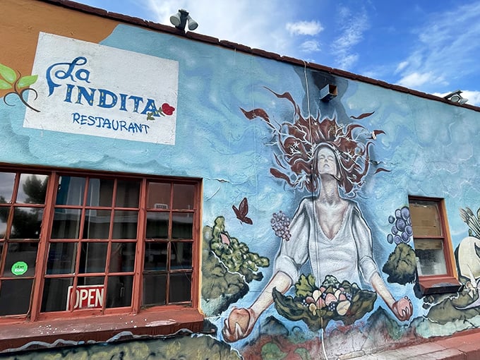 La Indita's stunning mural transforms a simple building into a neighborhood landmark. Art outside, artful cooking inside.