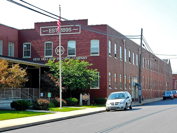 The New Holland Machine Company building, established 1895, reminds us that innovation and tradition have long been neighbors in Amish country.