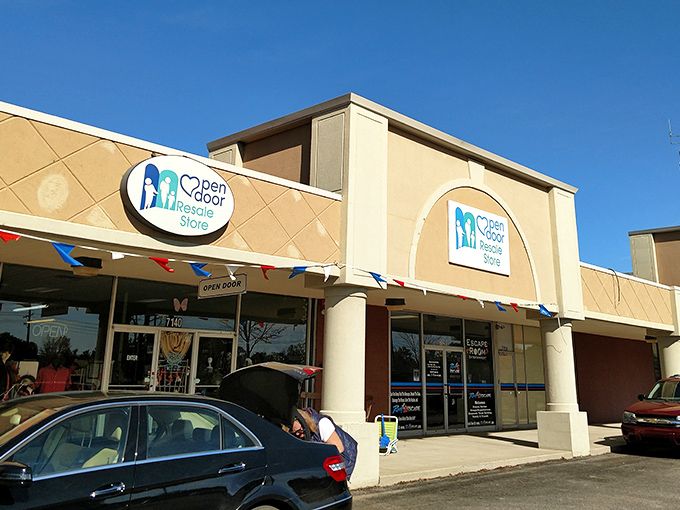 Open Door's cheerful storefront with colorful bunting signals the friendly shopping experience waiting inside.