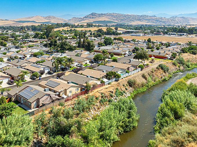 Porterville's sun-drenched neighborhoods spread beneath mountain views that would cost millions elsewhere but come standard here.