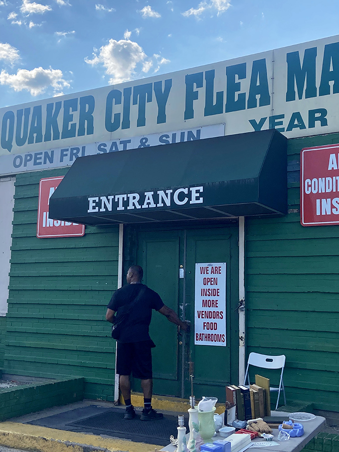 The distinctive green entrance to Quaker City Flea Market welcoming bargain hunters. Philadelphia's temple of treasures awaits!