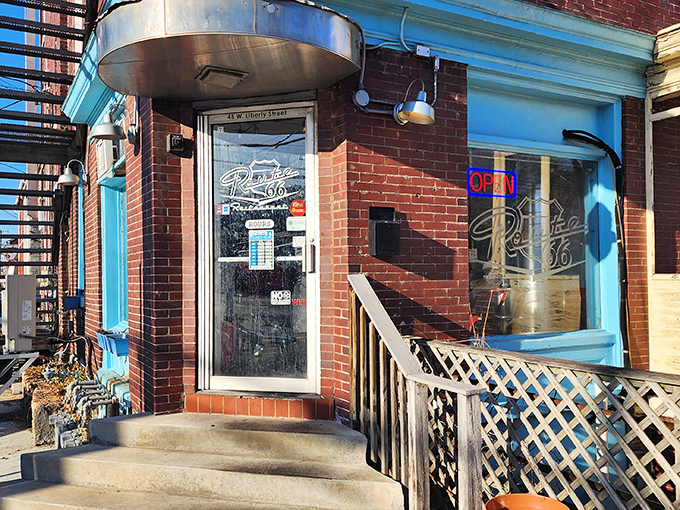 Route 66's bright blue trim frames a doorway to burger nostalgia &ndash; no DeLorean required for this tasty time travel.