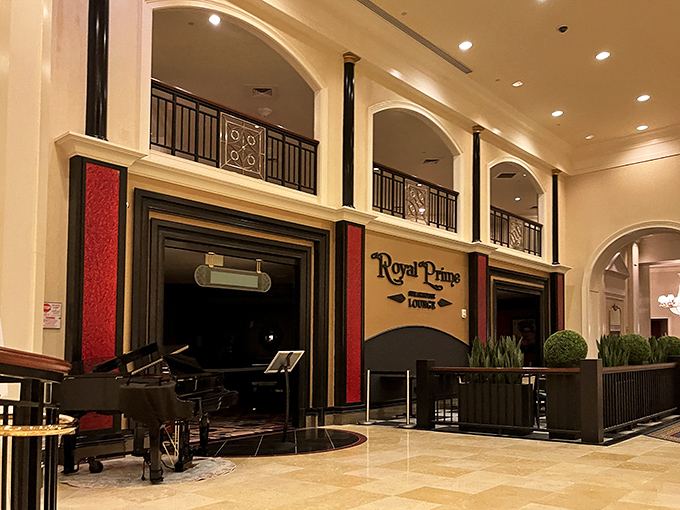 Royal Prime's grand entrance feels like stepping into a meat palace. That piano isn't just for show&mdash;it sets the tone for luxury.