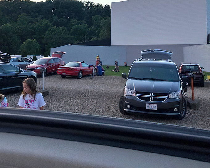 Camping chairs and pickup trucks – the VIP seating arrangement of choice for drive-in movie veterans.