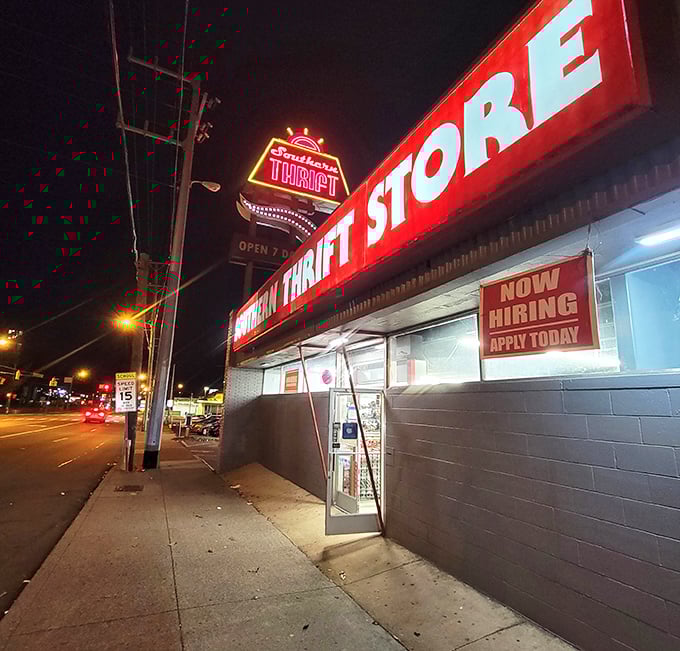 Southern Thrift Store's neon sign glows like a beacon for night owls seeking bargain adventures.