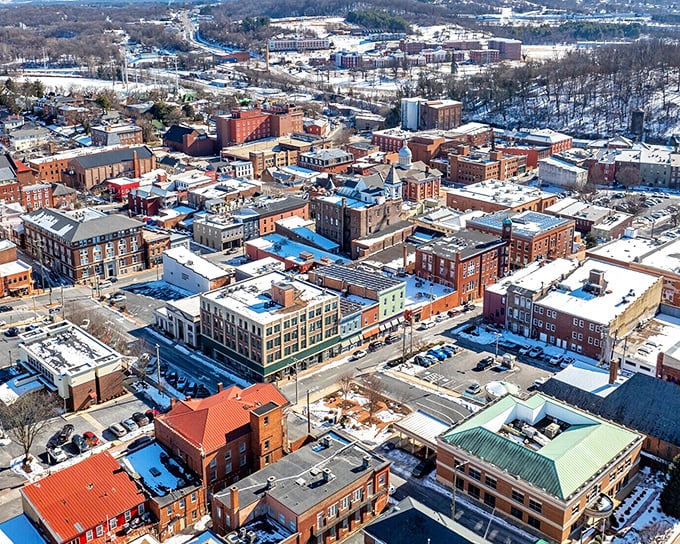 Staunton's aerial view reveals a patchwork of historic buildings and red rooftops nestled in Virginia's Shenandoah Valley.