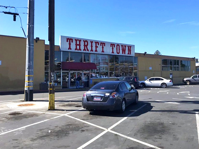 Thrift Town's bold red sign promises adventure. Like a carnival for bargain hunters, but the only cotton candy here is in the vintage t-shirt section.