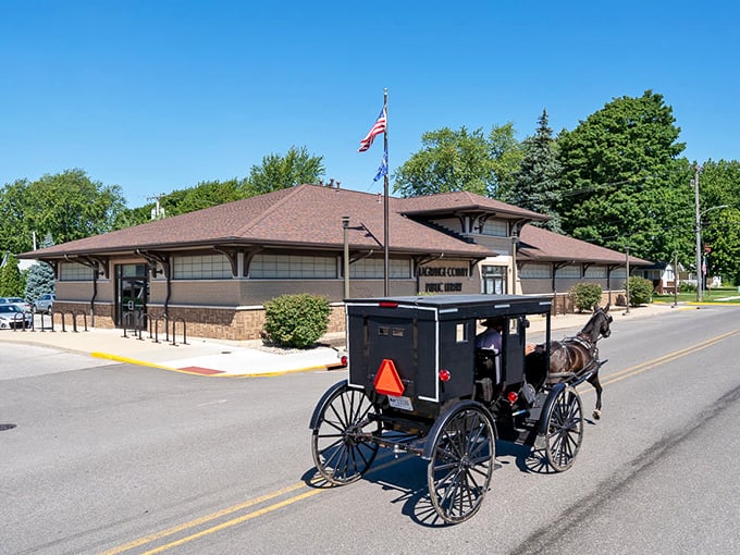 In Topeka, even the post office run happens at trot speed. That black buggy against the historic building is Indiana's version of a time machine.